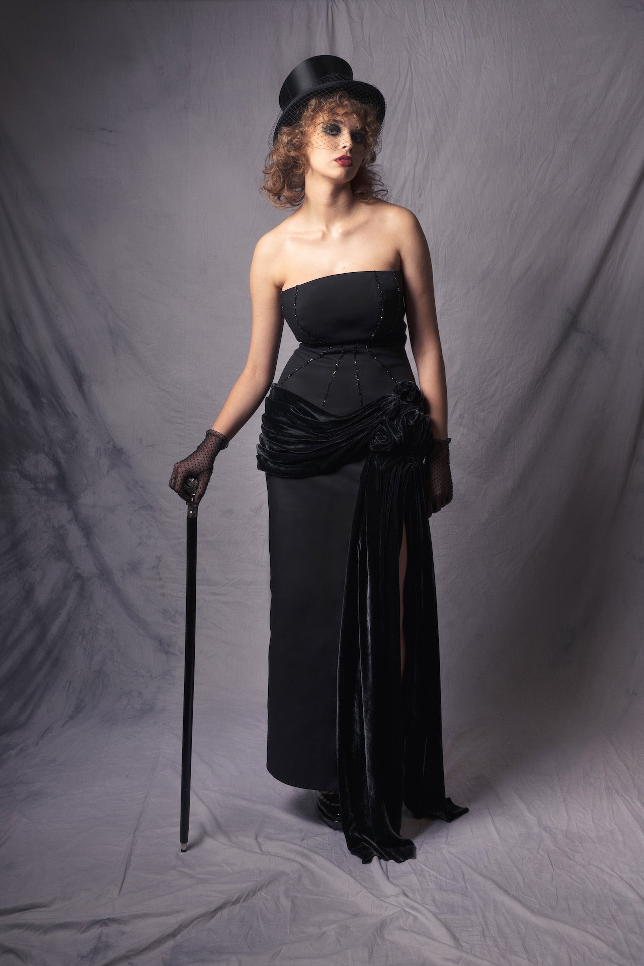 Off-shoulder black dress with beaded corset top and a silk velvet ...